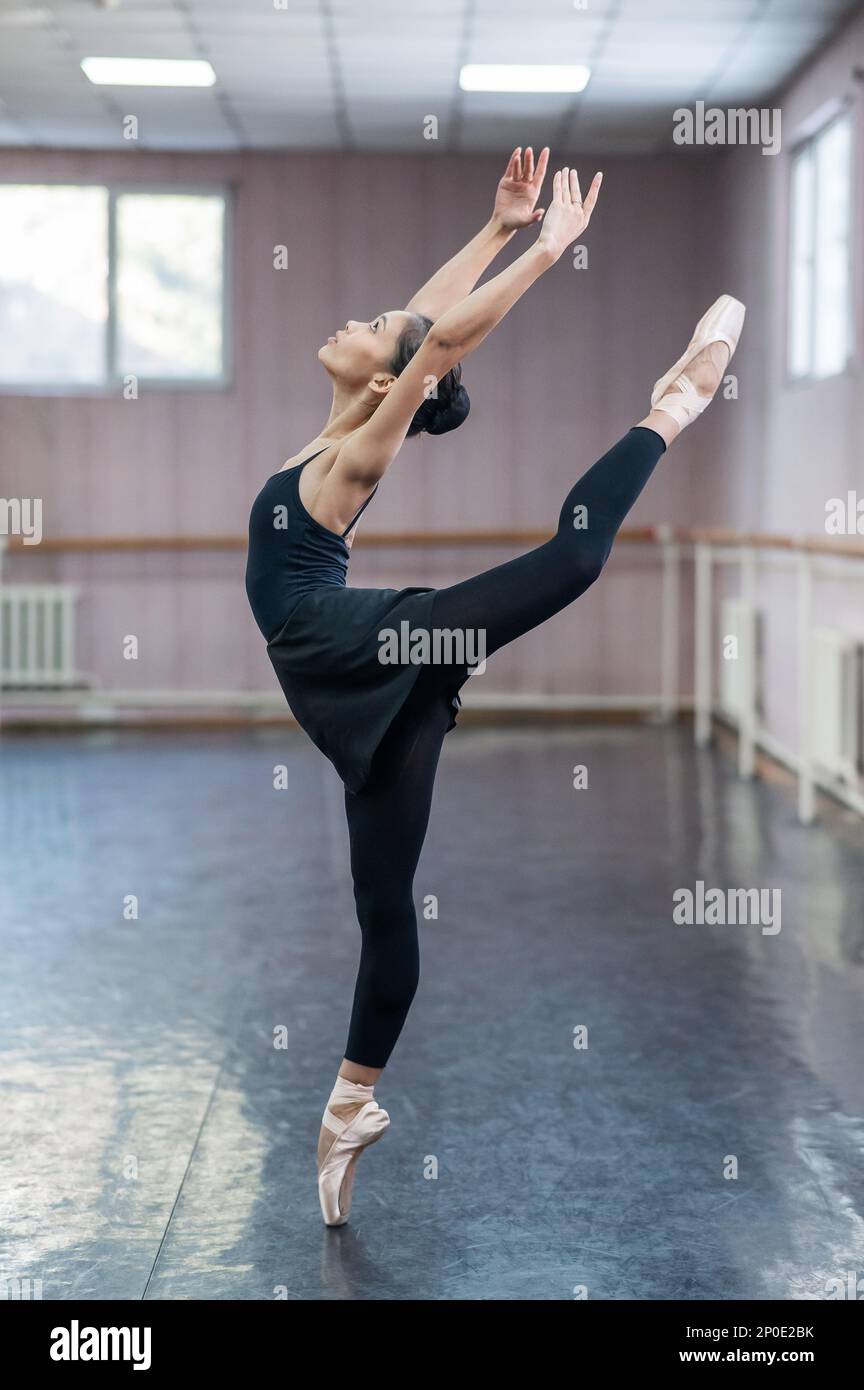 Asian woman dancing in ballet class doing bilman pose Stock Photo - Alamy