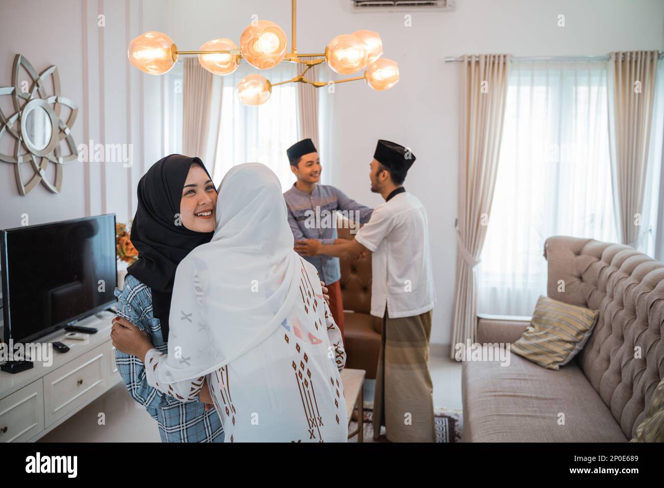 Muslim family embracing during hi-res stock photography and images - Alamy