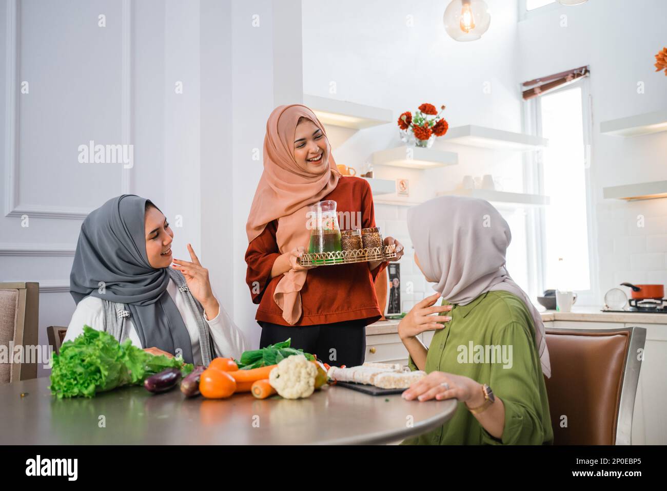 muslim woman serving drink for friend and family after fasting Stock ...