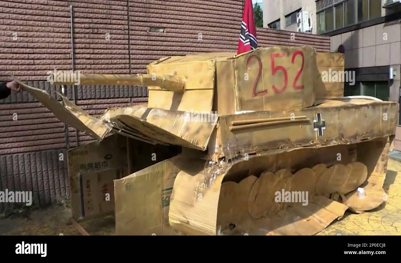 In this image made from video, a cardboard tank with a Nazi-themed flag ...