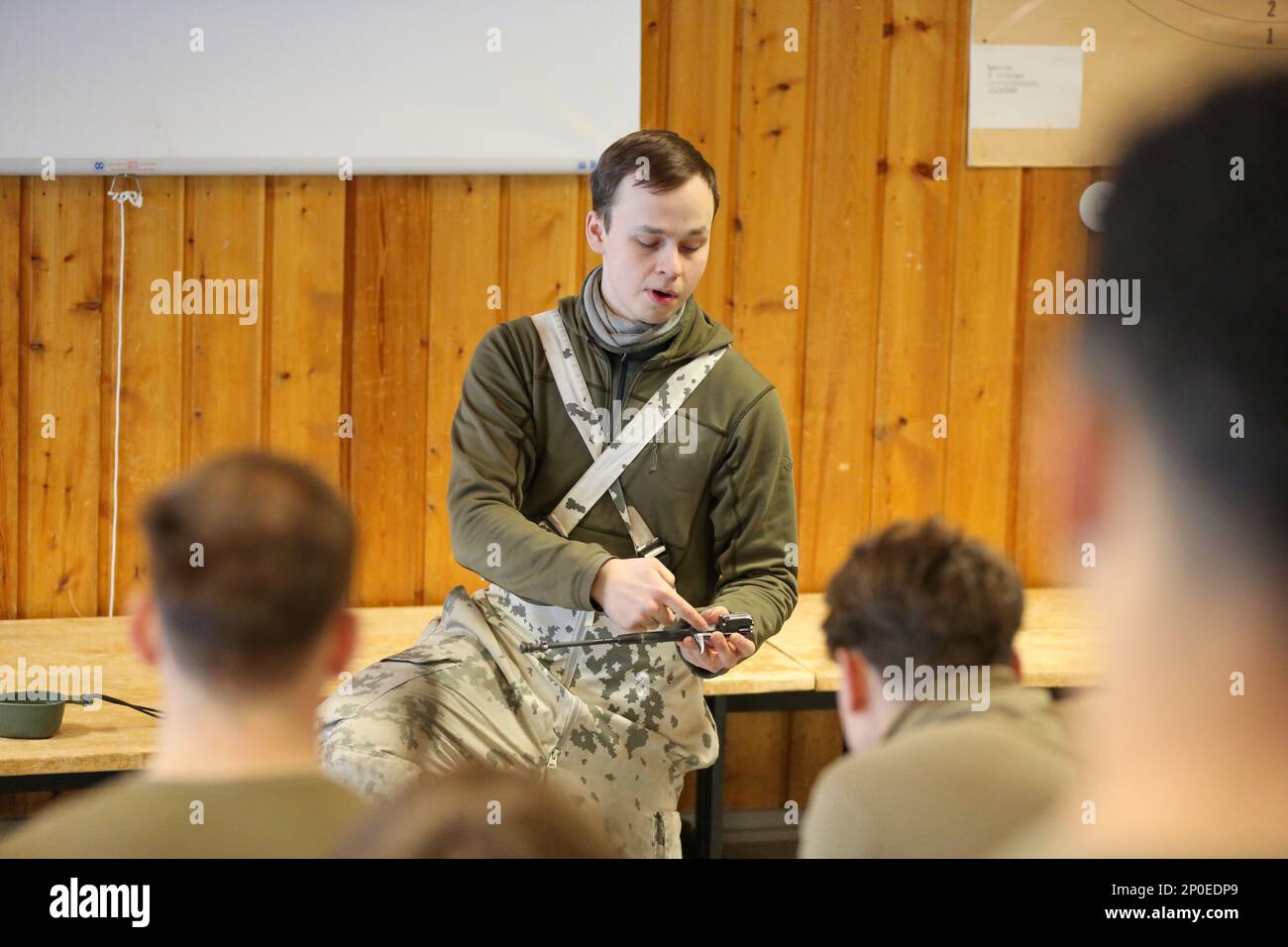 A Finnish army soldier provides a class to soldiers from Charlie Troop ...