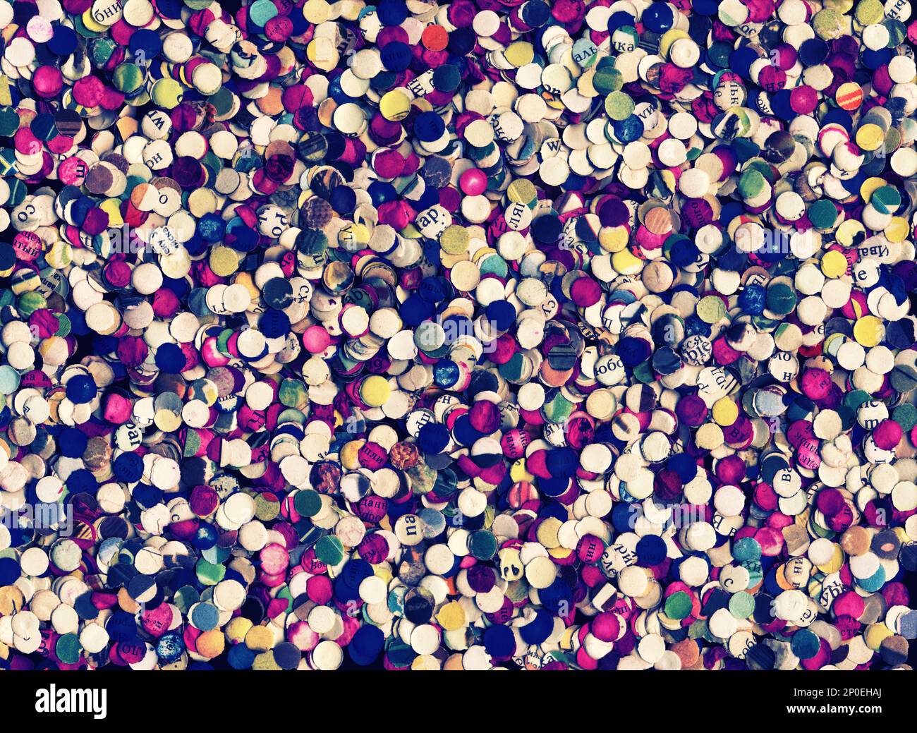 Colorful round paper confetti made of recycled used old books ...