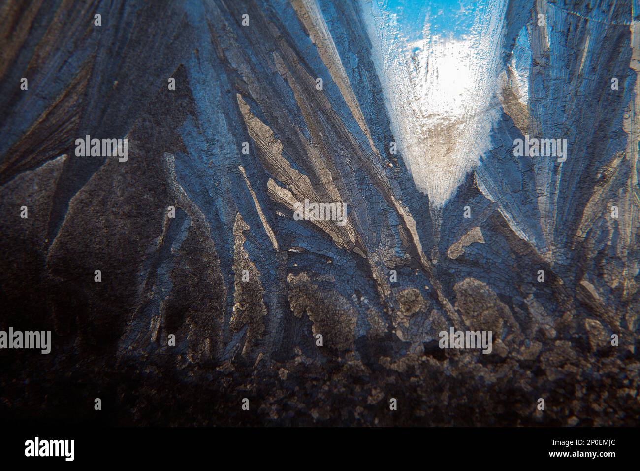 Dark frozen ornate icing window glass Christmas background pattern at ...