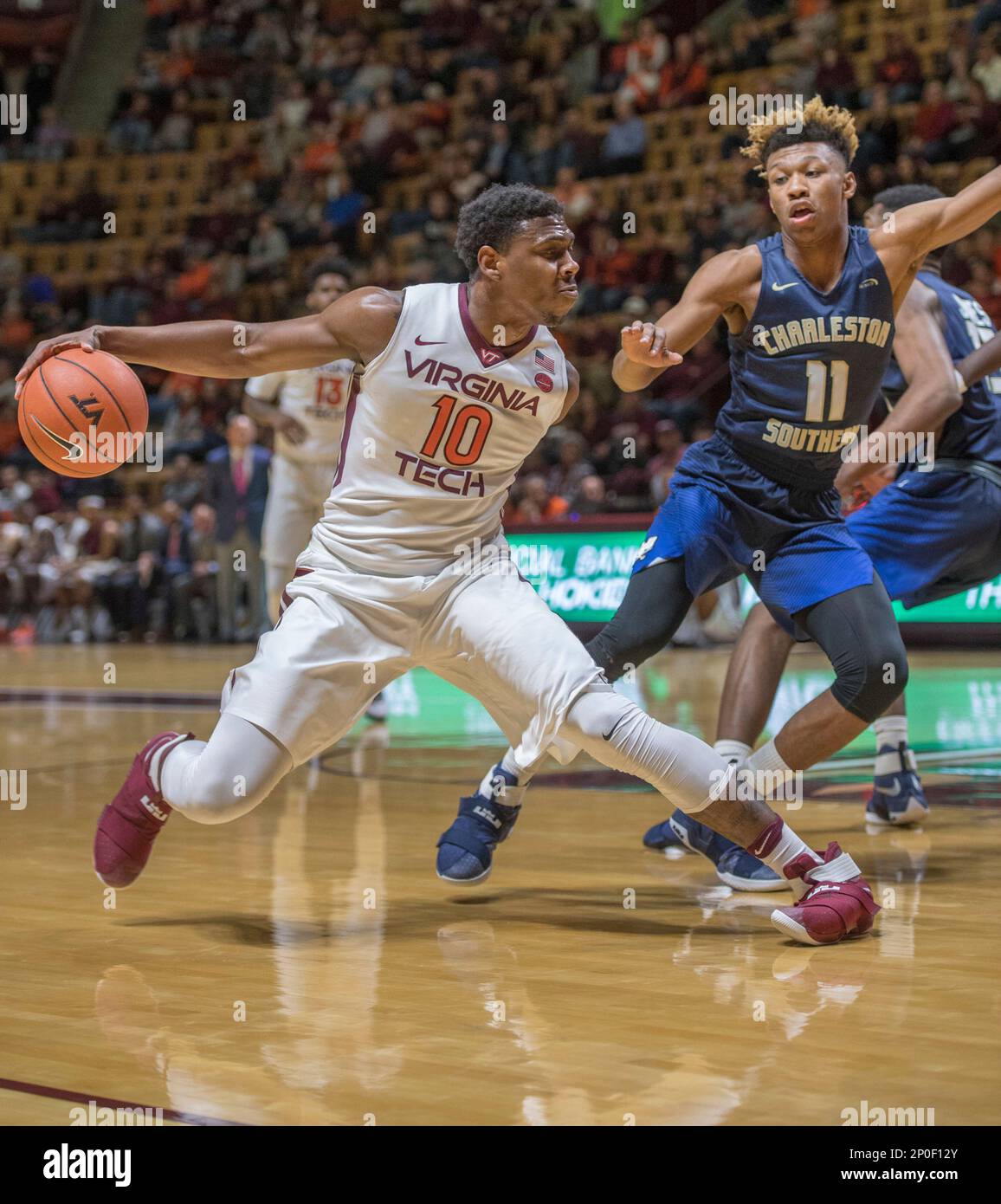 Virginia Tech guard Justin Bibbs (10) drives on Charleston Southern ...