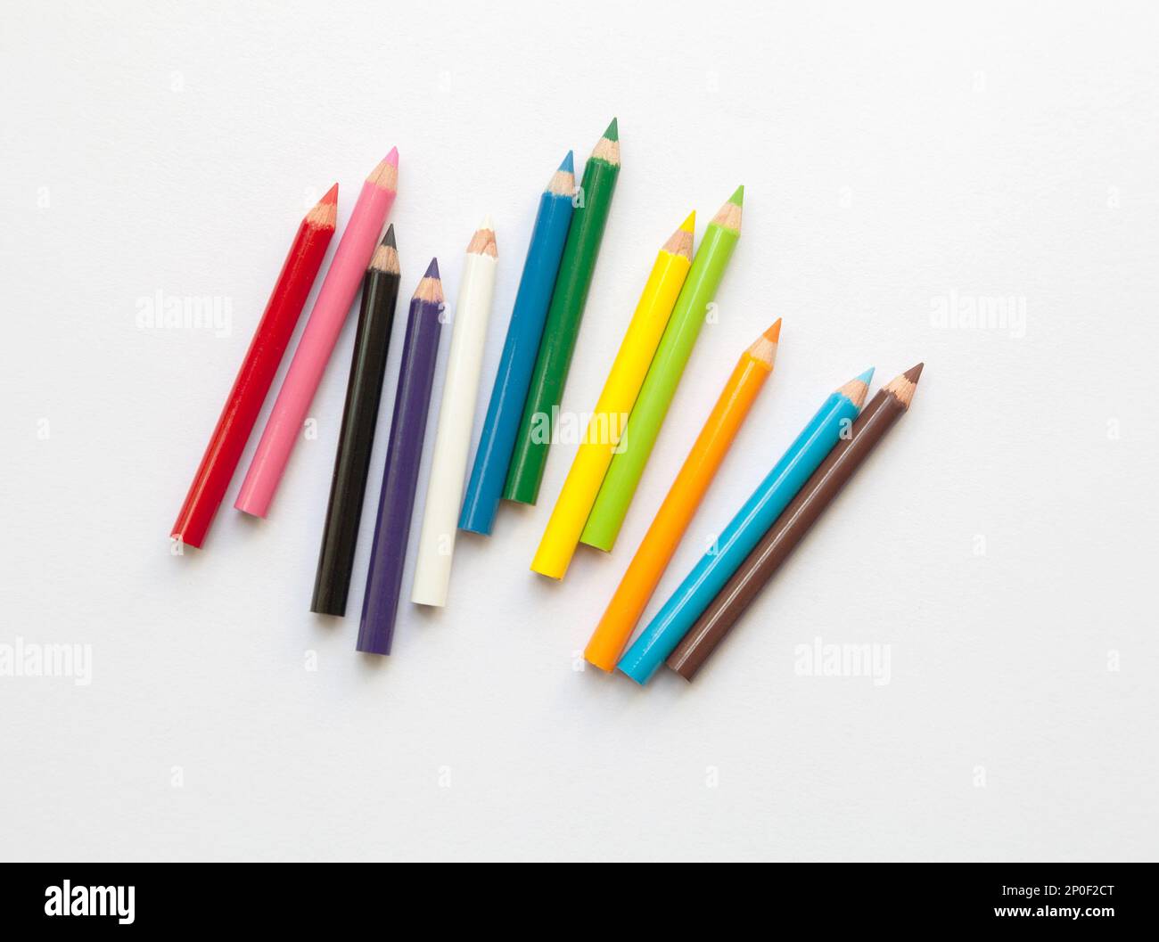 Bunch of fun mini colored pencils isolated on white. Multicolor group ...