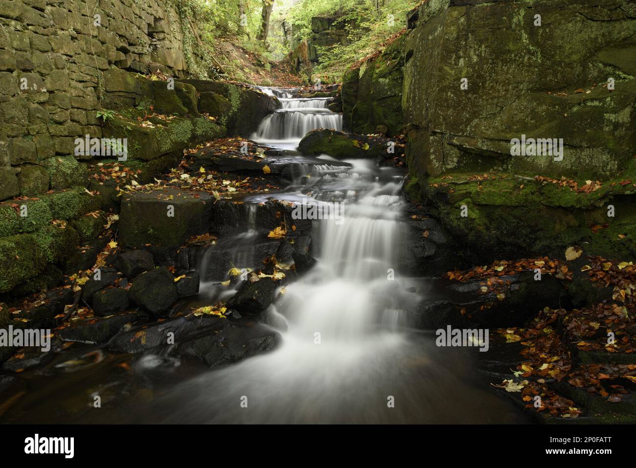 Cascading river and wall of mill ruins, Lumsdale Upper Cascades ...