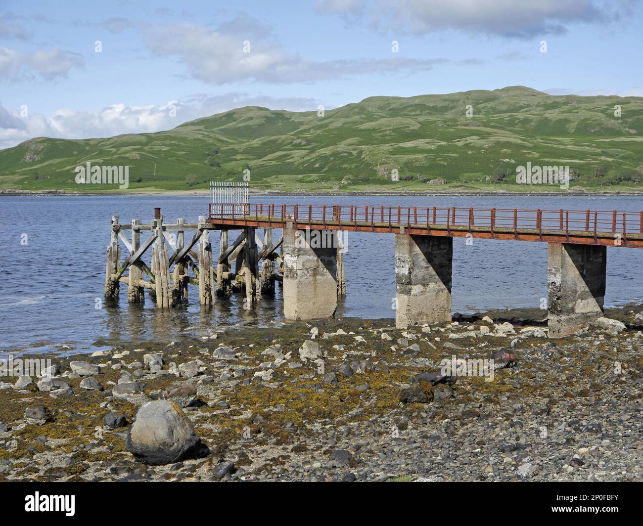 View of jetty on shore of sea loch, Loch Spelve, Firth of Lorn, Isle of ...