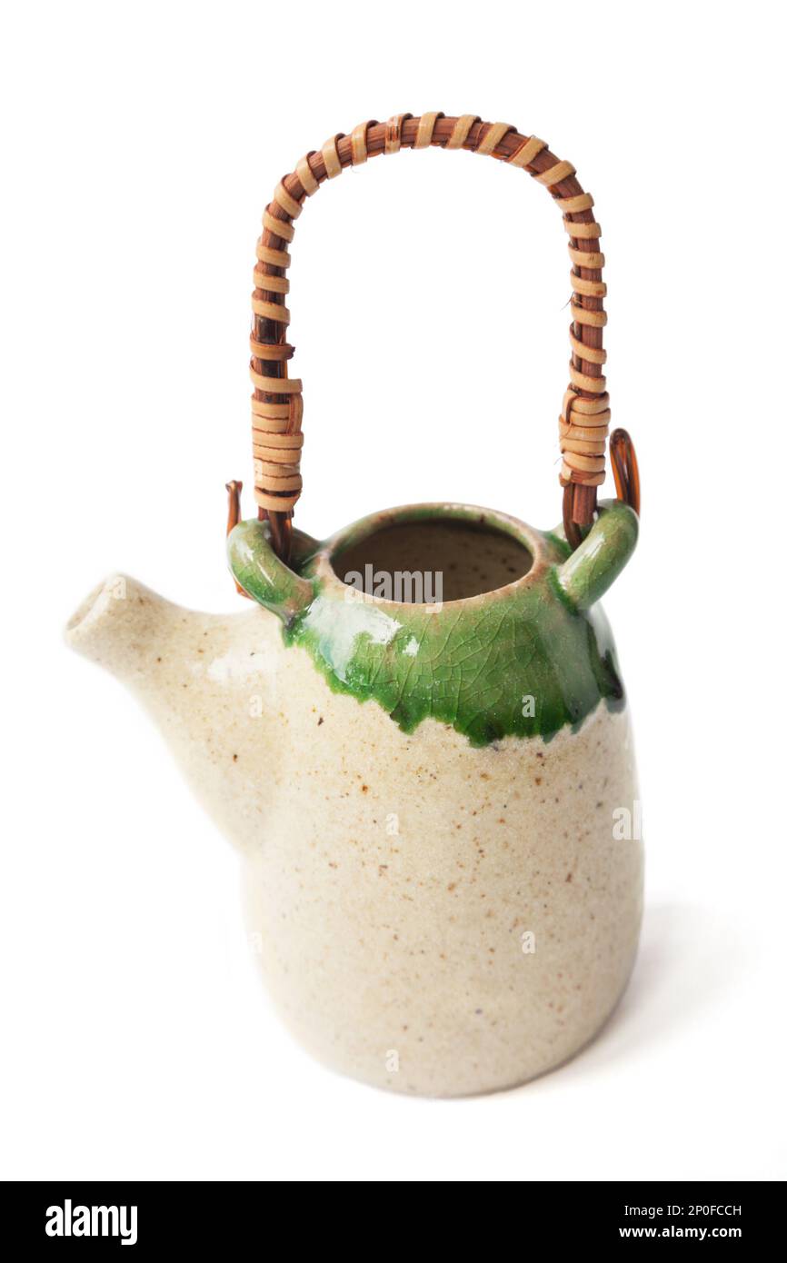 Lovely little Asian ceramic glazed teapot isolated on white. Cute tall ...