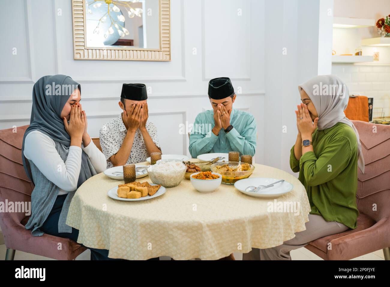 Malay family eating hi-res stock photography and images - Alamy