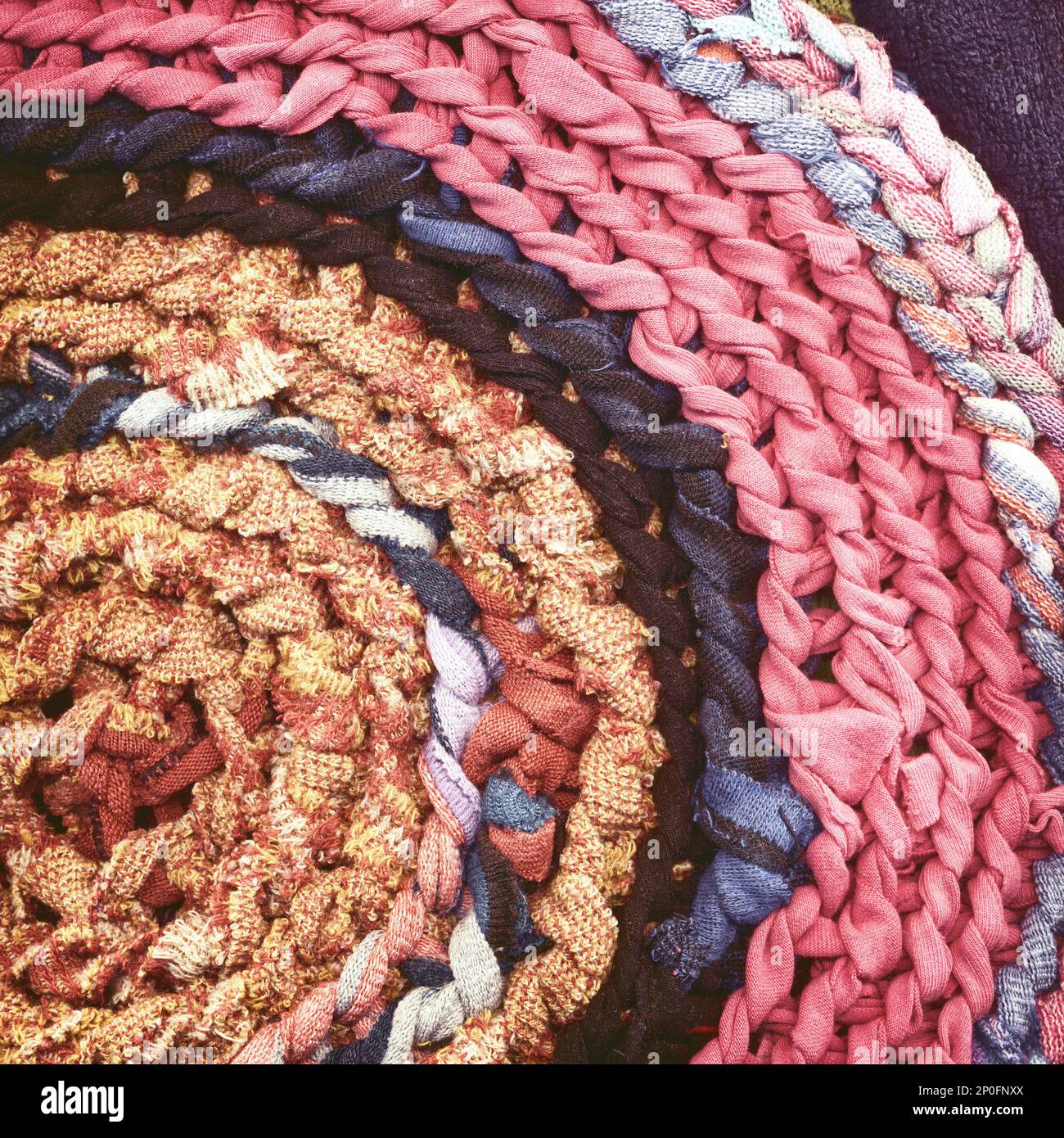 Round handmade rug close-up background. Knitted textile carpet pattern ...