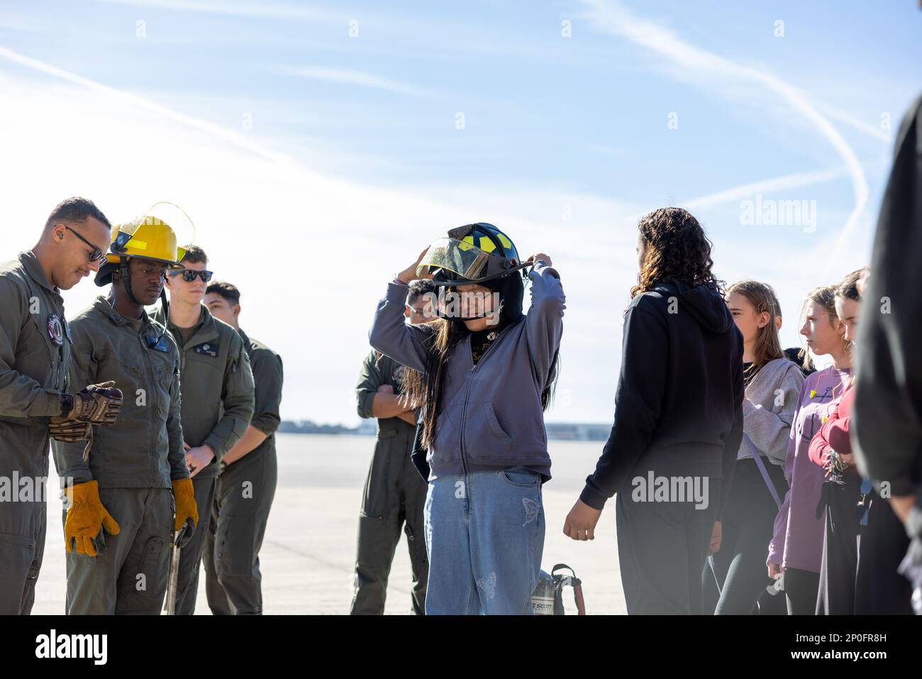 A Grover C. Fields Middle School student puts on a safety helmet while ...