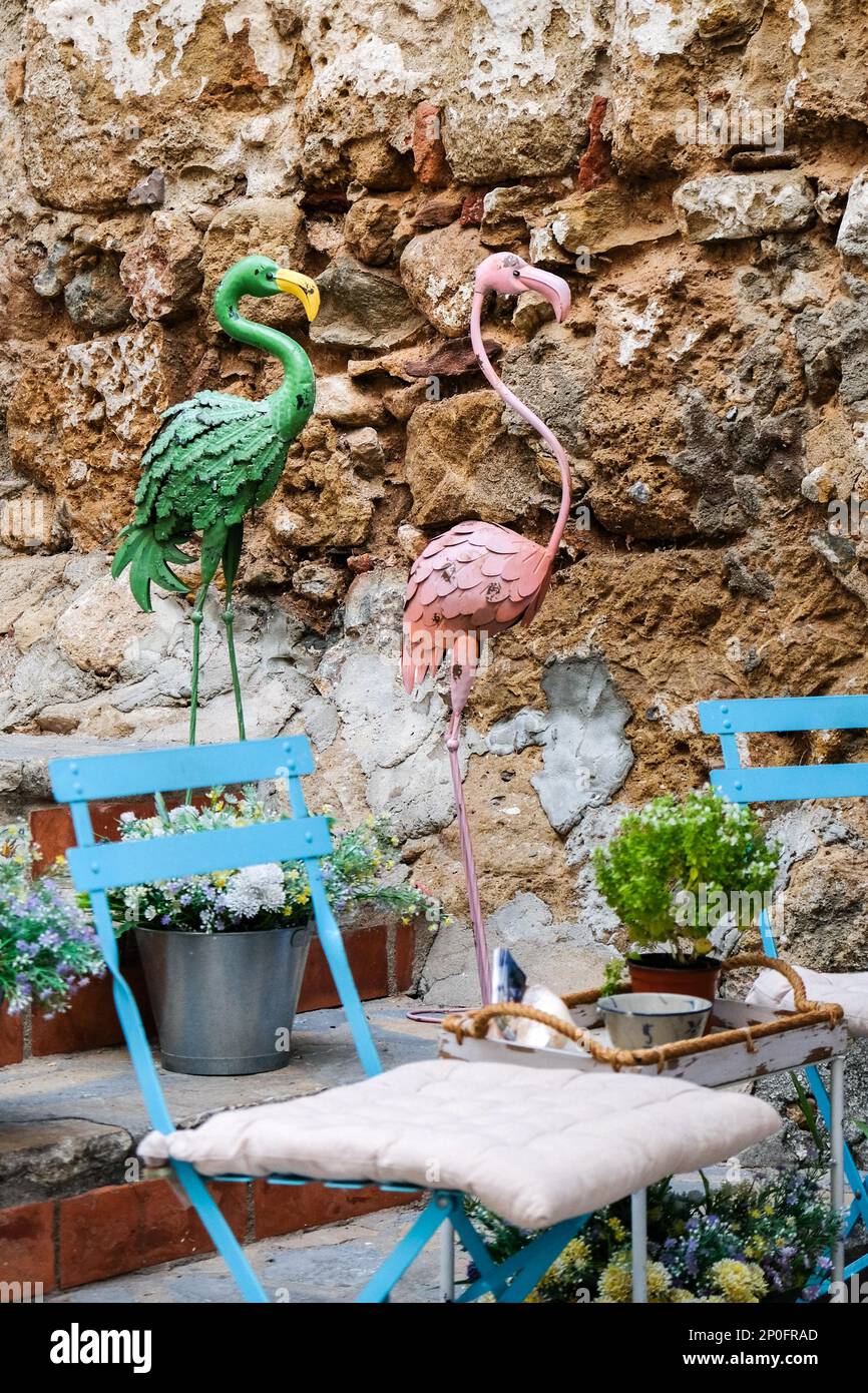 Green and Pink Flamingos in Marbella Stock Photo - Alamy