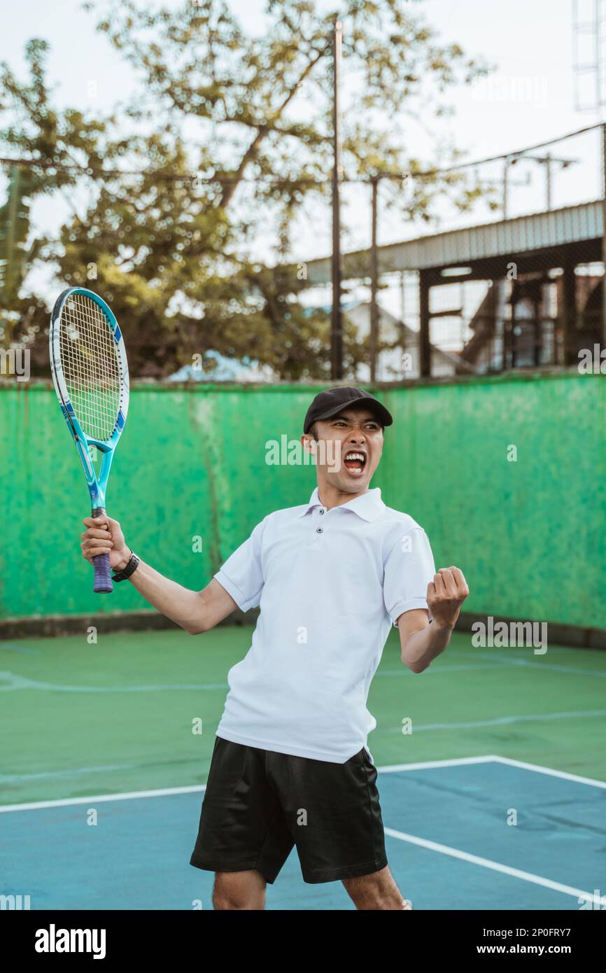 male tennis players get excited while getting points while playing ...