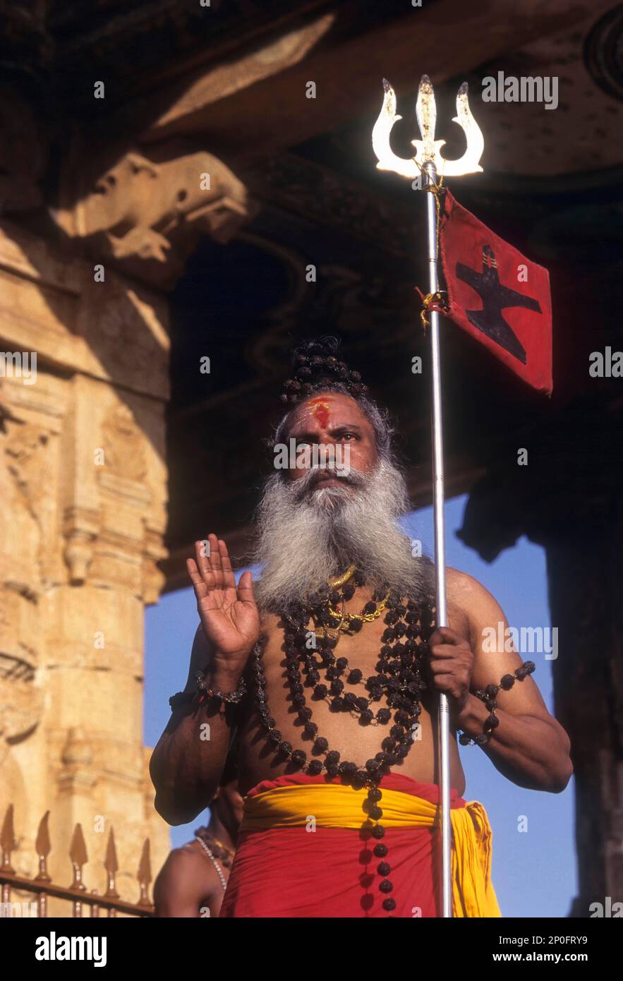 A sadhu standing on the floor of Nandi mandap in Brihadeeswarar Temple ...