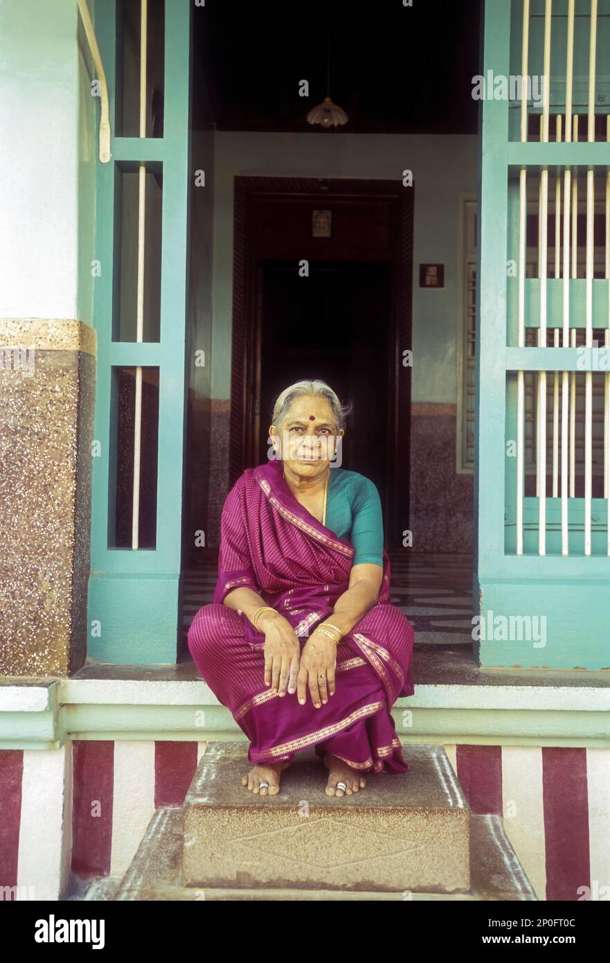 A bramin old lady sitting in front of her Agraharam house at ...