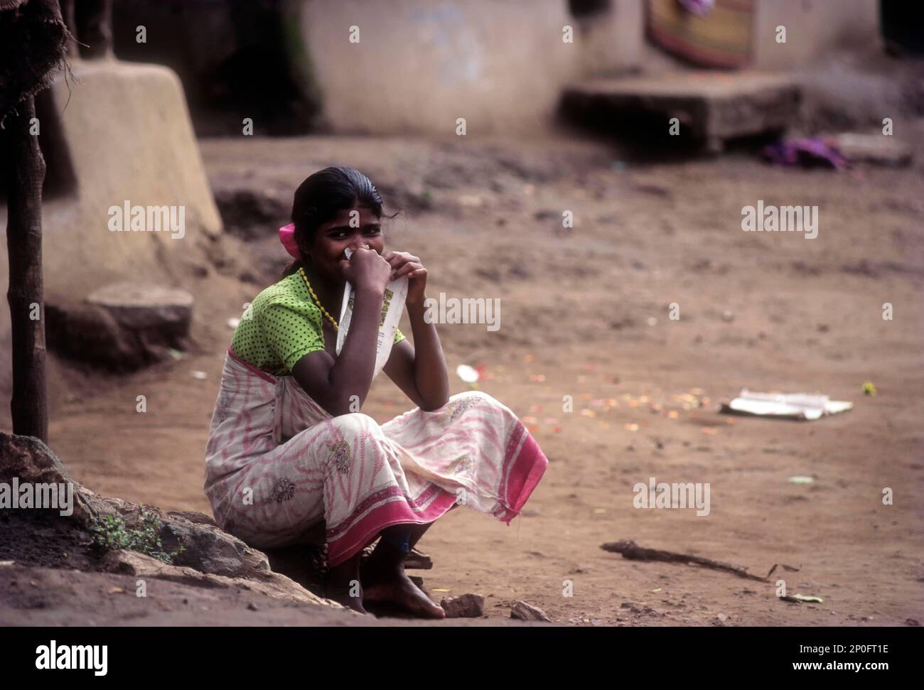 Betta Kurumba belle sitting in front of her hut, Tribal at Mudumalai ...
