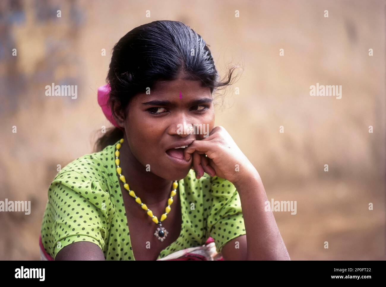 Betta Kurumba belle sitting in front of her hut, Tribal at Mudumalai ...