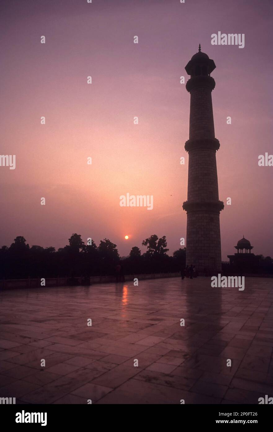 Sunset behind the minarets, that surround the main tomb of the Taj ...