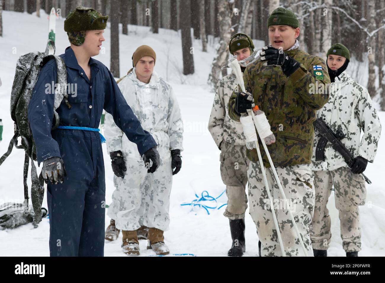 A Finnish winter survival instructor assigned to Jaeger Brigade, instructs a group of Finnish ...