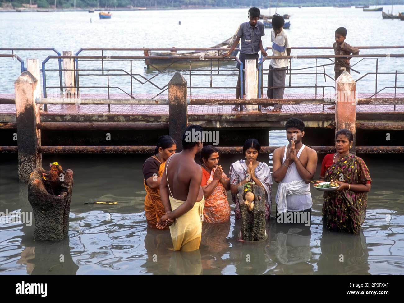 A group of people worshipping Navagraha idols, nine planetary deities ...