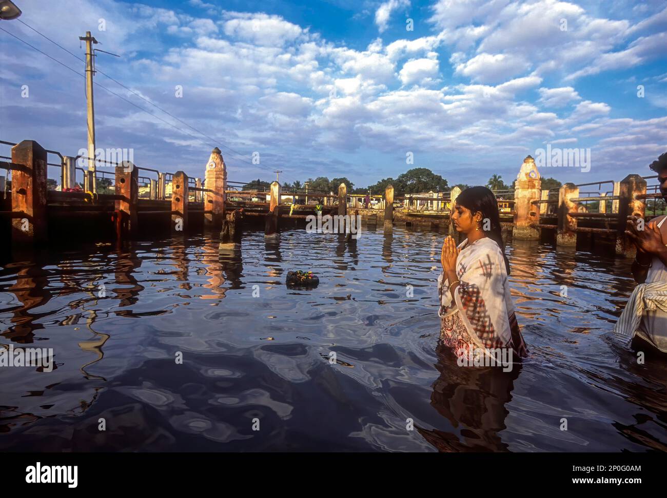 A girl worshipping Navagraha idols nine planetary deities made of ...