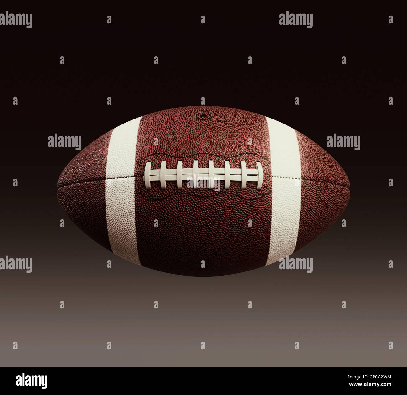 A generic unbranded american football ball on an isolated studio ...