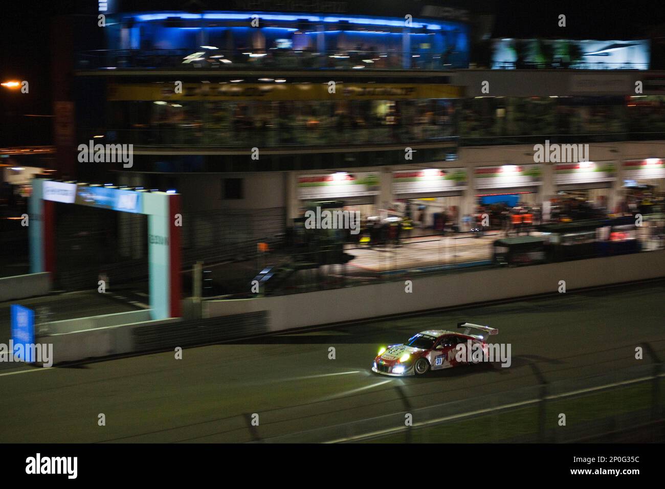 Nuerburgring, race track at night, Porsche 911 GT3 R, passing pit lane ...