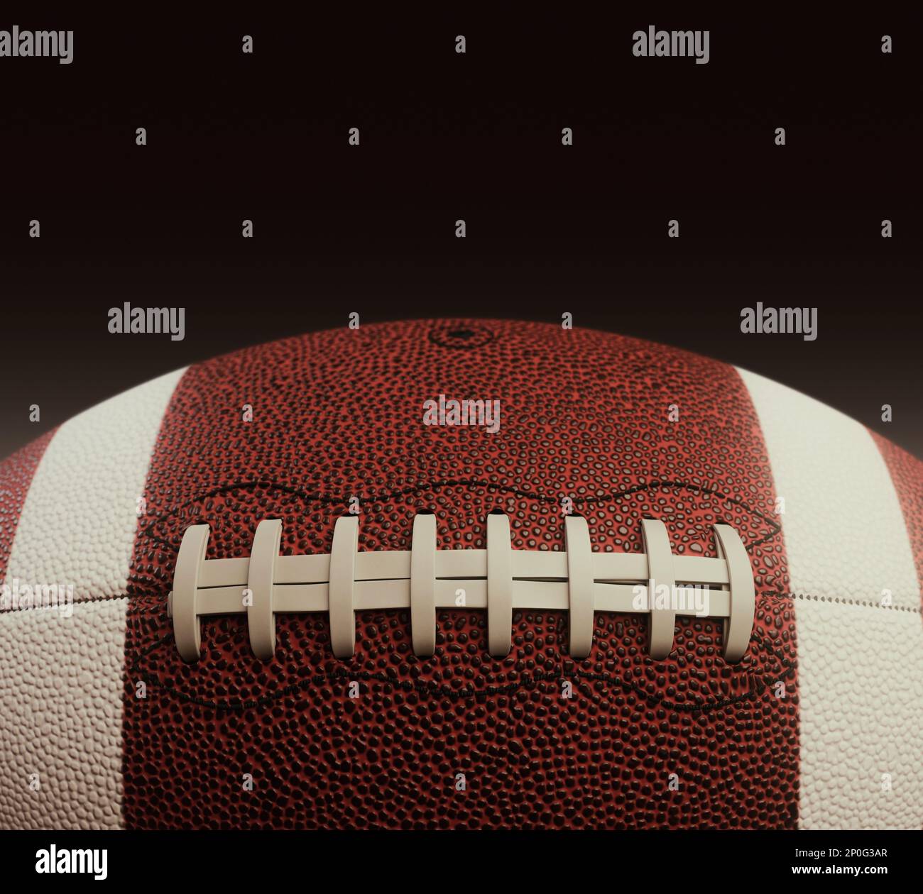 A generic unbranded american football ball on an isolated studio ...