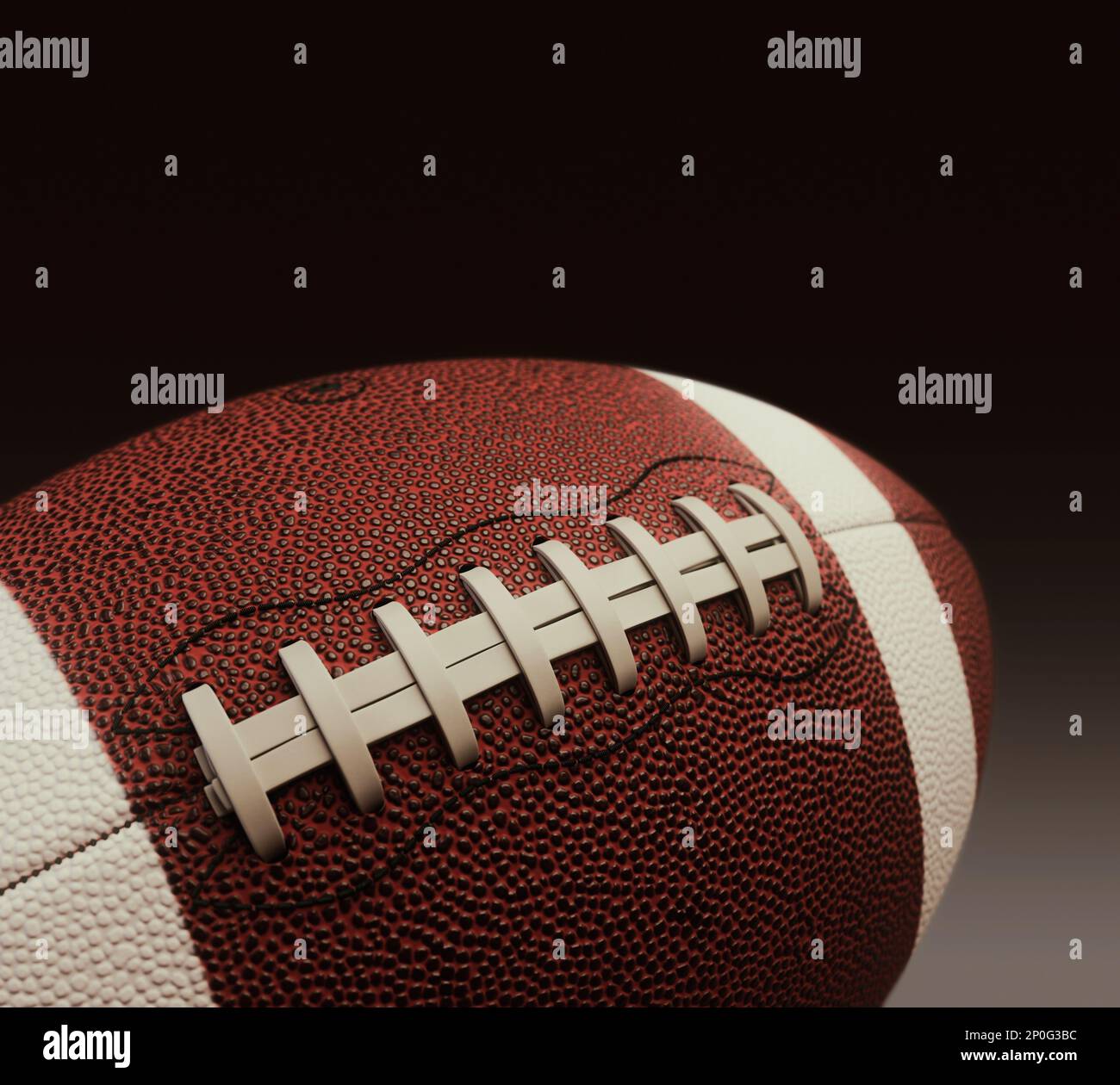A generic unbranded american football ball on an isolated studio ...