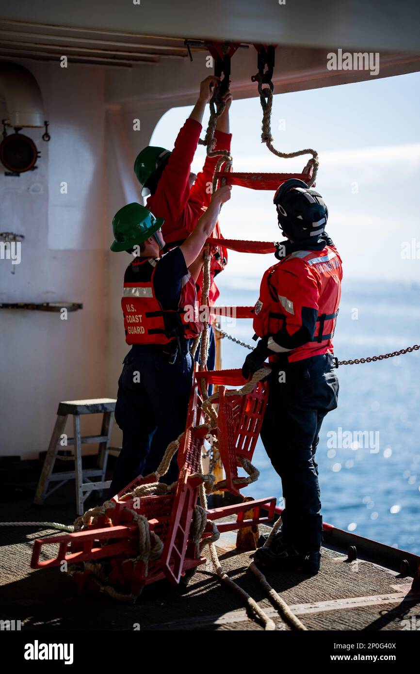 Coast Guardsmen on Coast Guard Cutter Polar Star (WAGB 10), hang a ...
