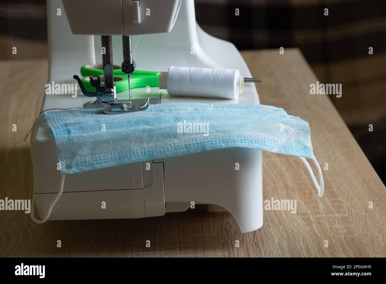 new sewing machine sews a medical mask during a pandemic Stock Photo ...