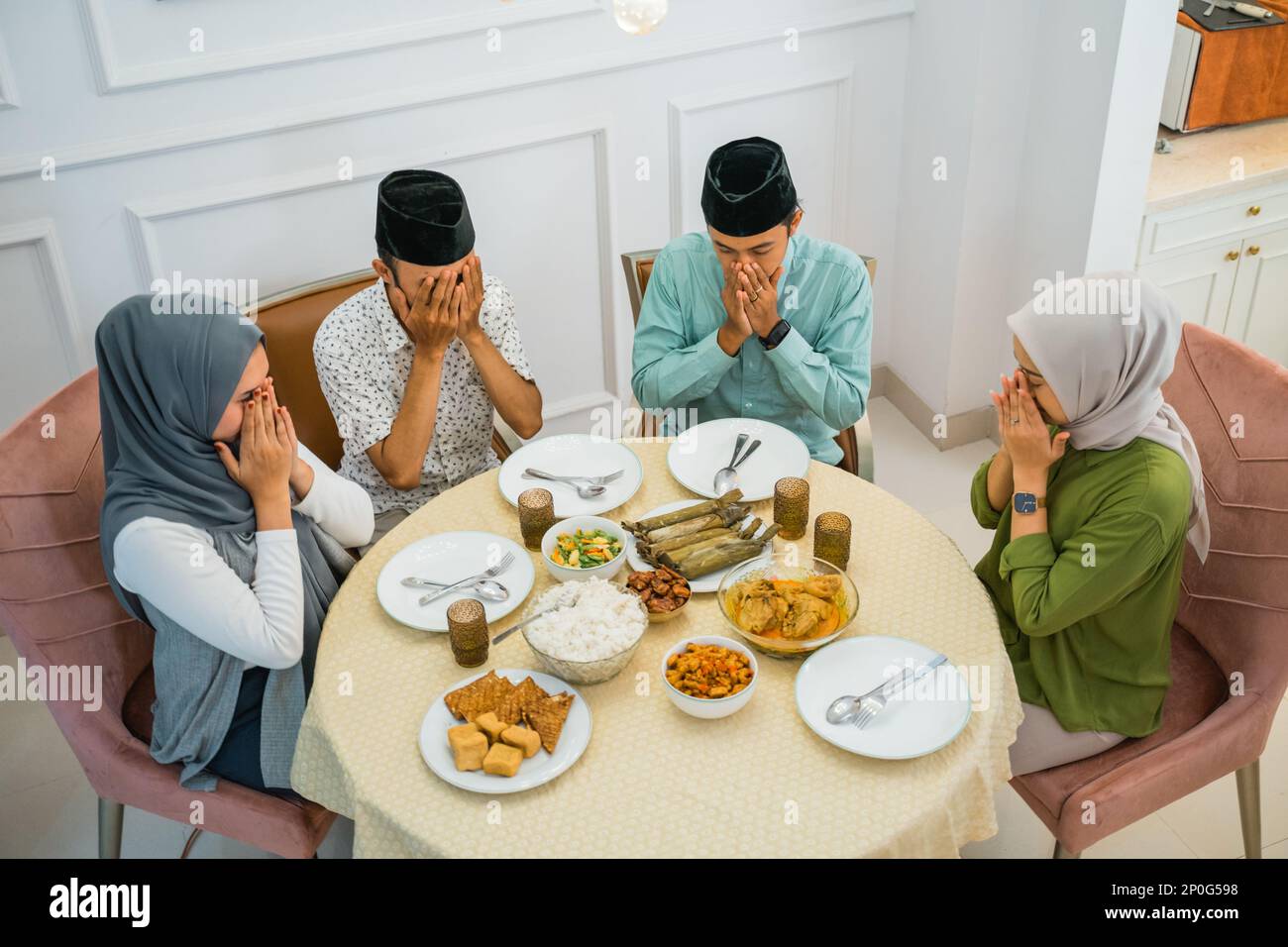 Malay family eating hi-res stock photography and images - Alamy