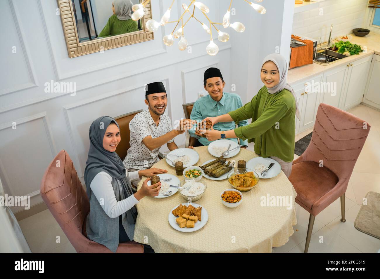 woman serving dates when breaking the fast with friends Stock Photo - Alamy