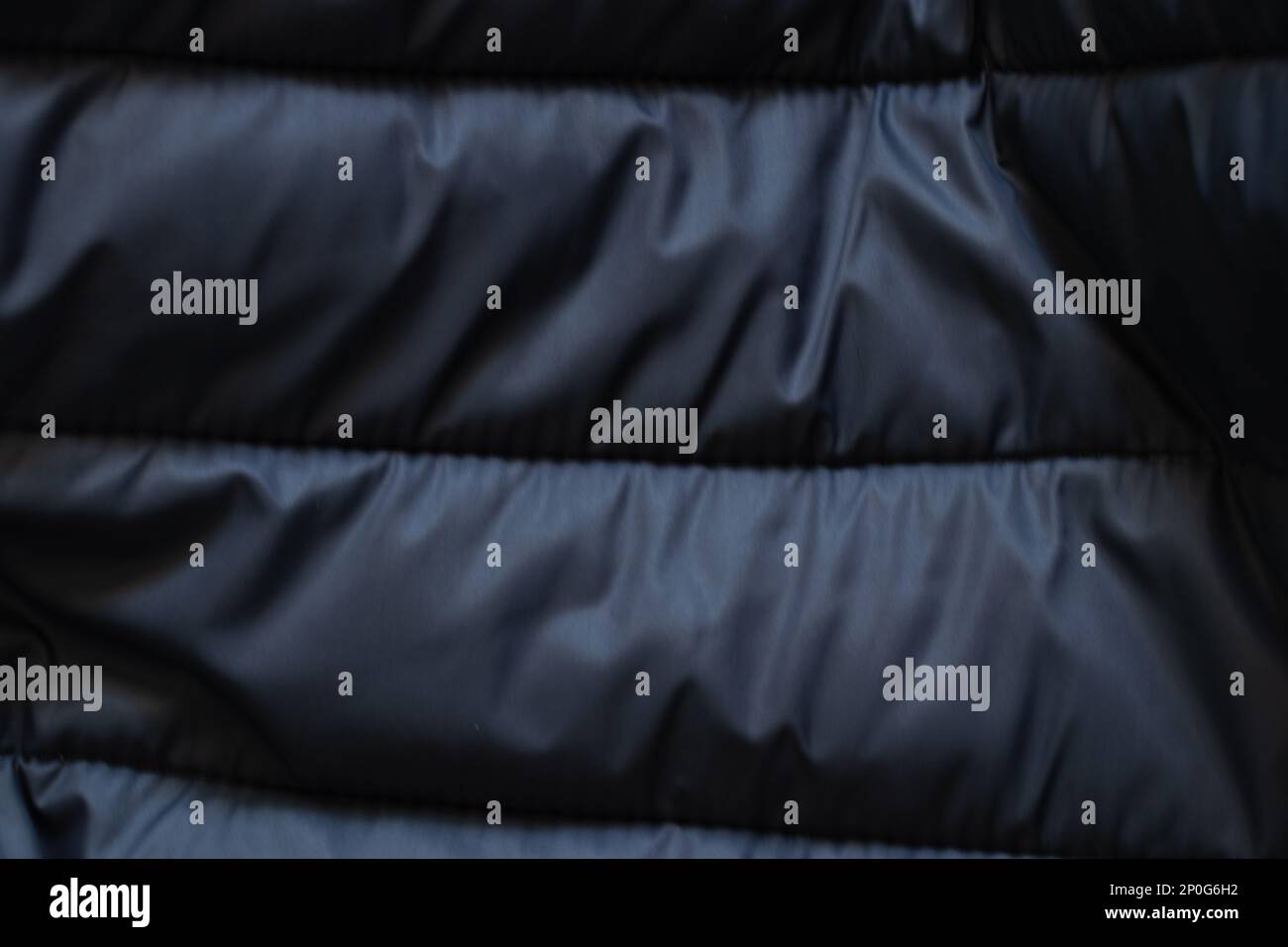 black puffer jacket material as background Stock Photo - Alamy