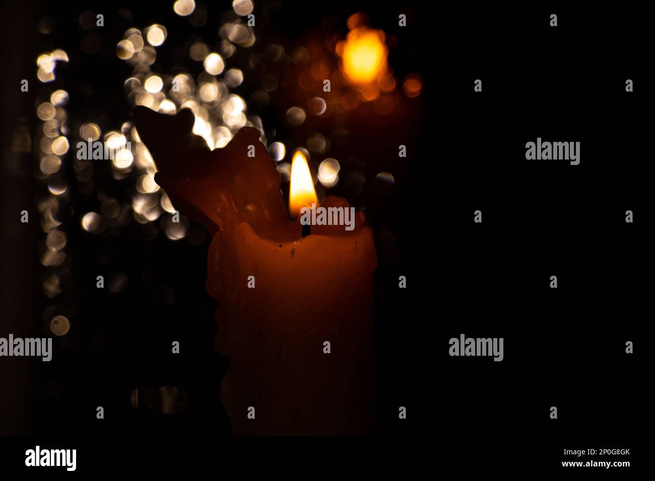 the flame of a church candle in a dark room Stock Photo - Alamy