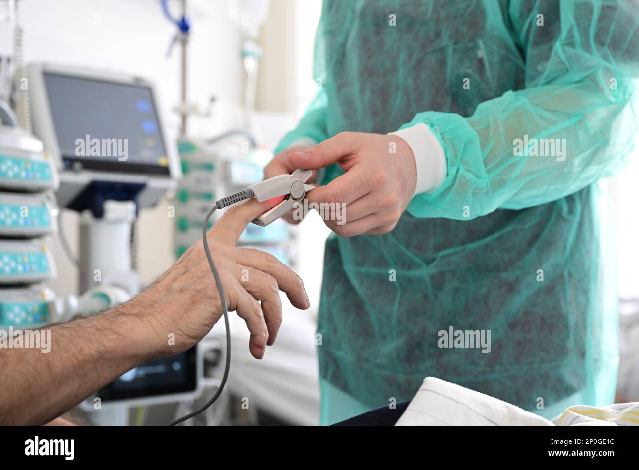 Stuttgart, Germany. 14th Feb, 2023. A nurse applies a measuring device ...