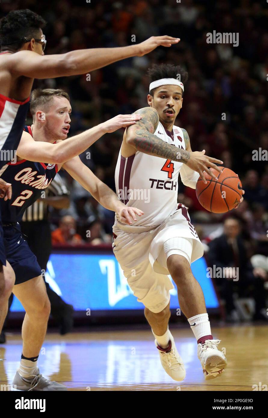 Seth Allen (4) of Virginia Tech drives past Cullen Neal (2) of Ole Miss ...