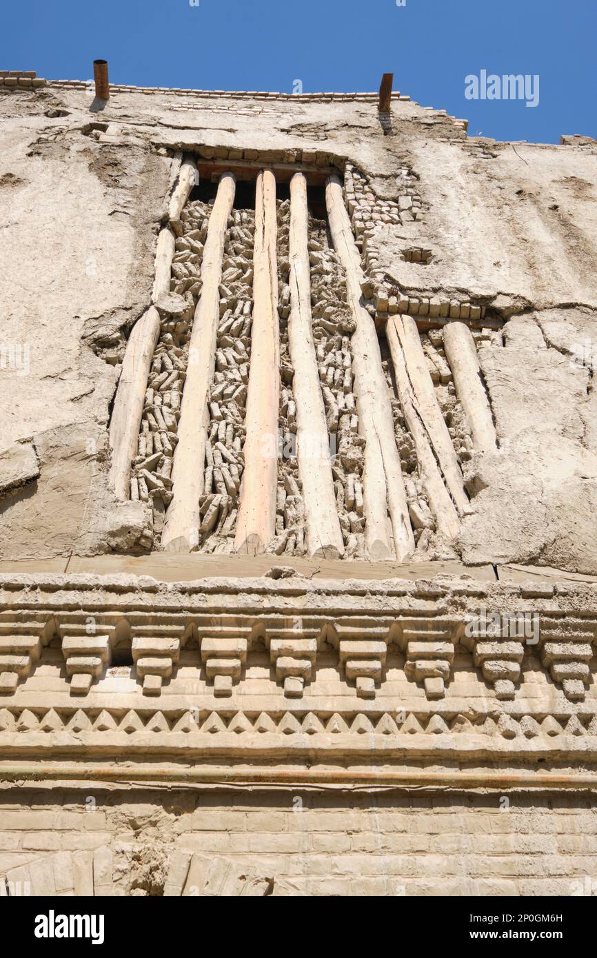 Wall detail, showing materials used. Sticks, wood columns, straw, mud ...