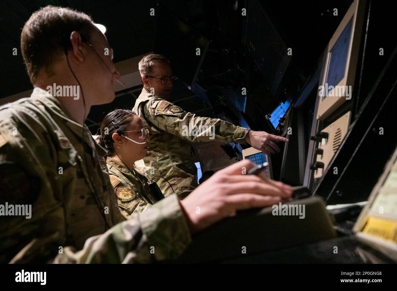 U.S. Air Force Senior Airmen Nicholas Anderson (left), Kristen McQueen ...