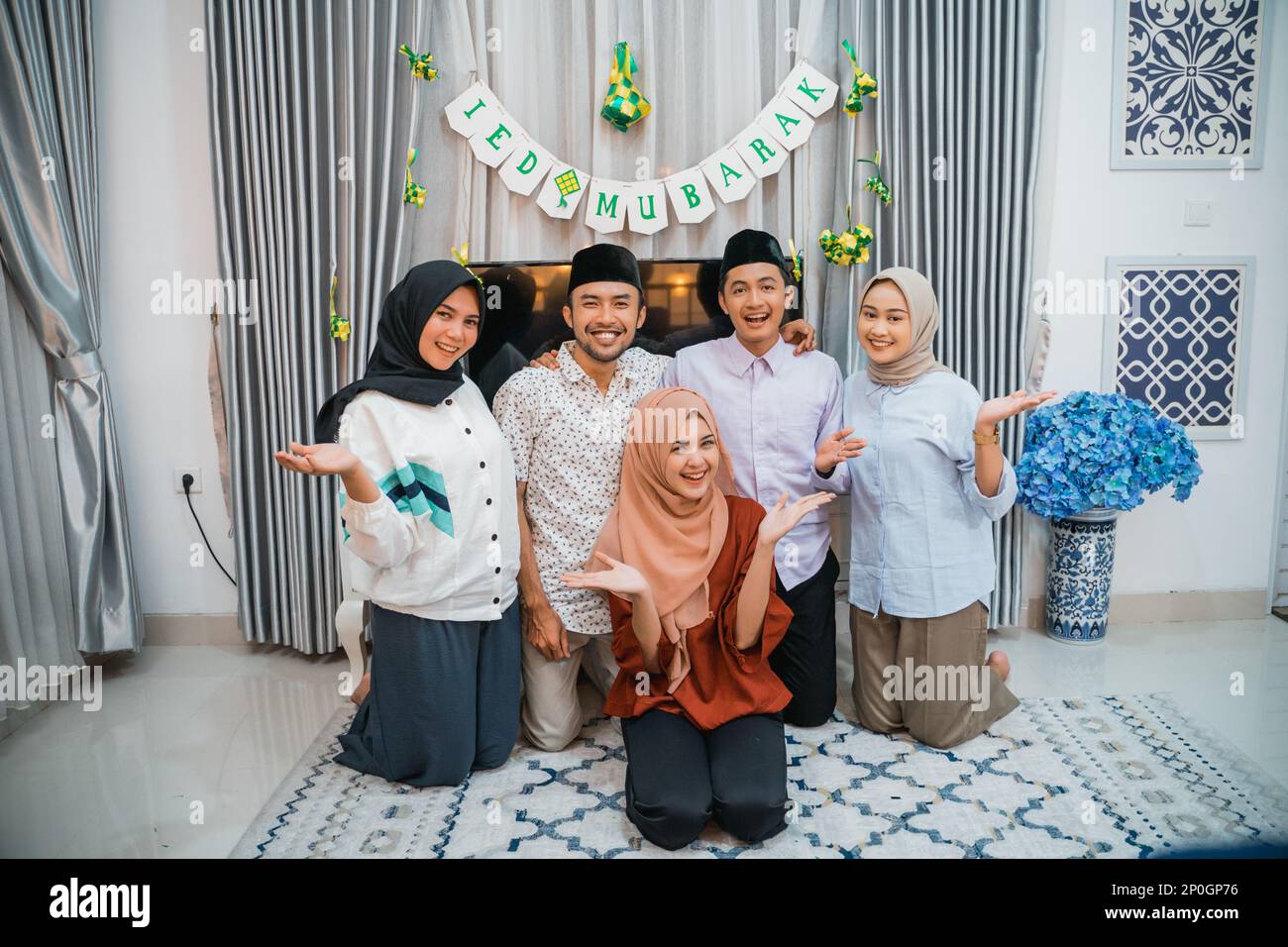 group of Muslims with hand gestures presenting during eid celebration ...