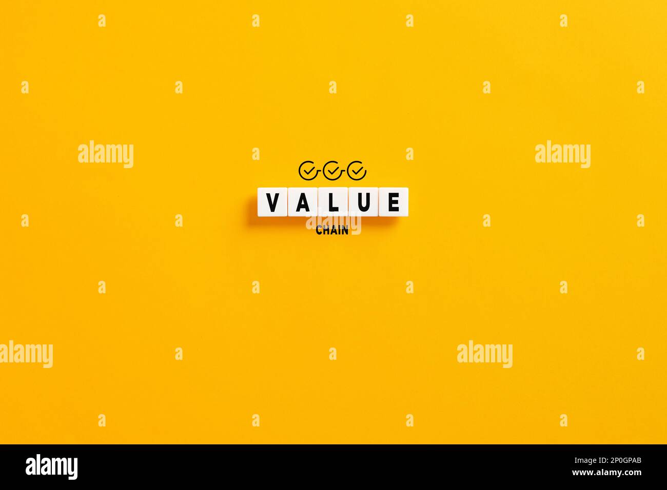 White letter blocks on yellow background with the word value chain ...