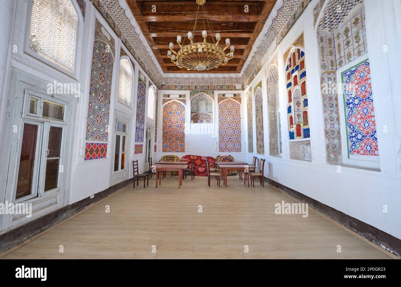A restored grand, living, reception room, now used with tables and ...