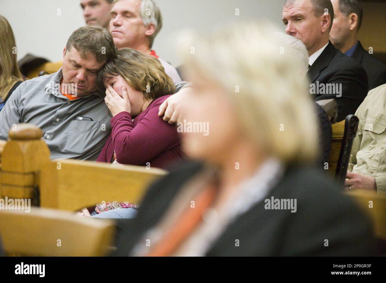 Larry Phillips and his wife Kimberly Phillips lean on each other during ...