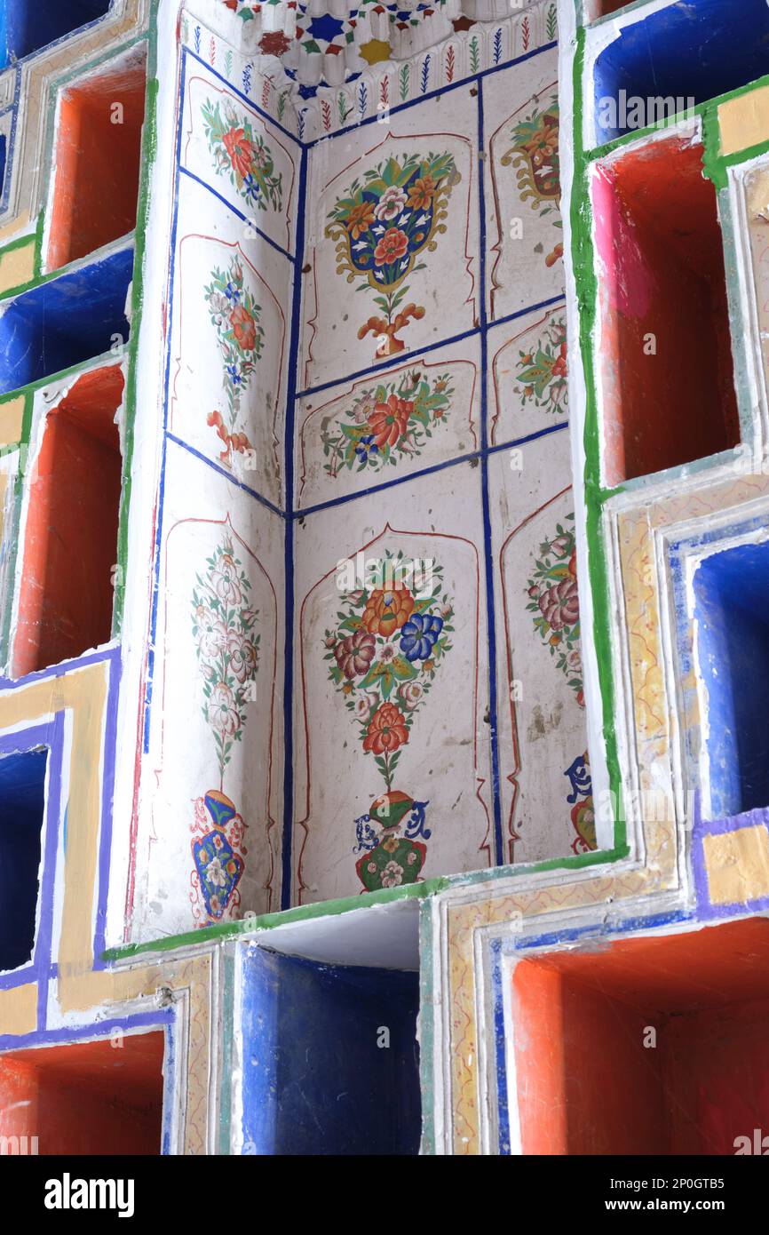 Detail of cutout, wood, plaster, painted casework with flower design ...