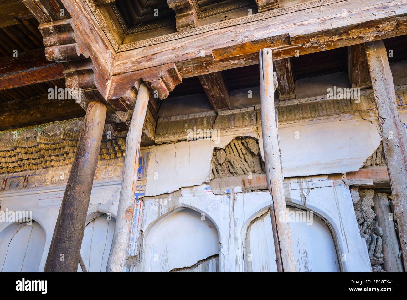 Detail of falling down porch overhang being supported by additional ...