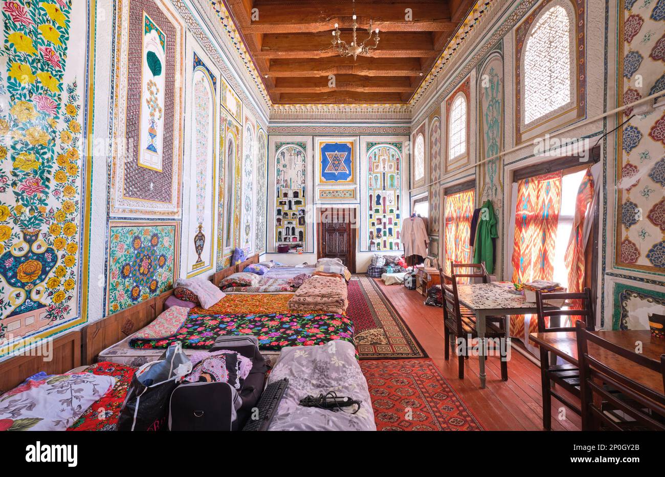 A grand receiving, living room, now used as a group bedroom at a hostel ...