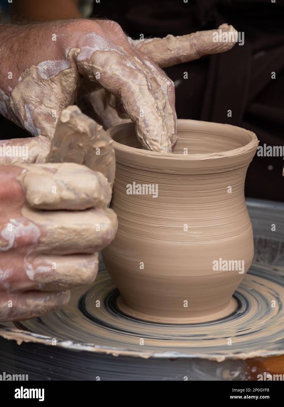 Master class on modeling of clay on a potter's wheel In the pottery ...