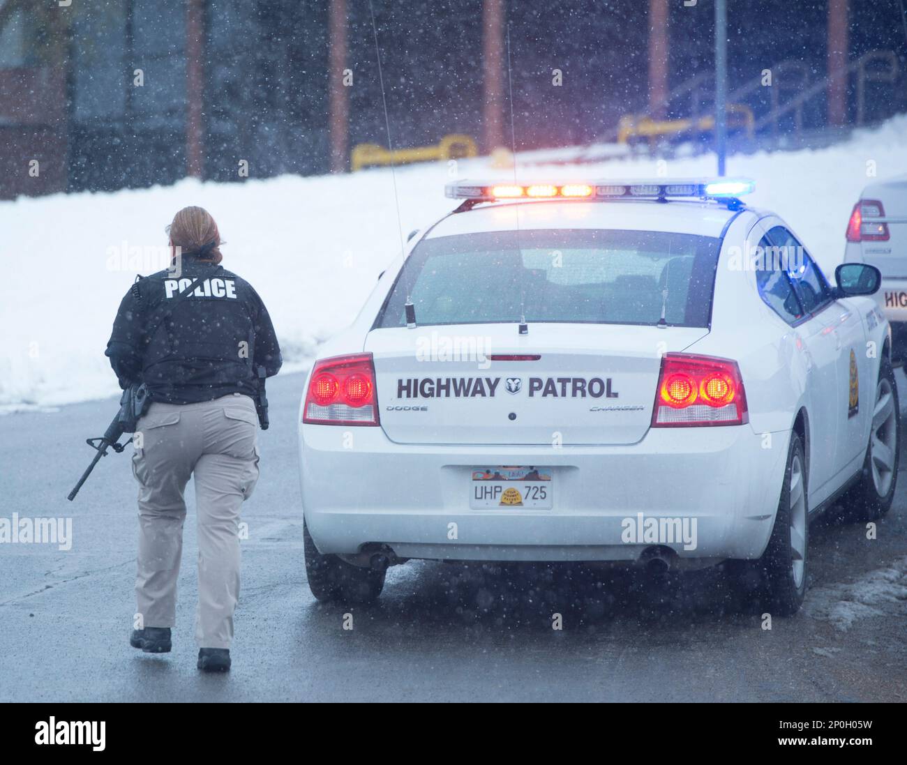 Police officers enter Mueller Park Jr High in Bountiful, Utah, around 8 ...