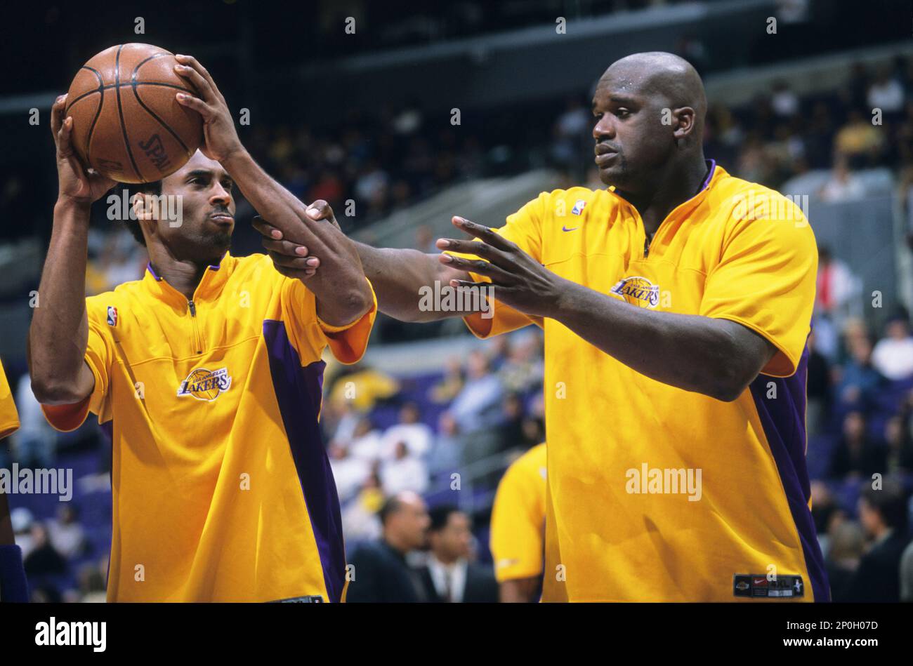 FILE: Los Angeles Lakers center Shaquille O'Neal grabs the arm of Kobe ...
