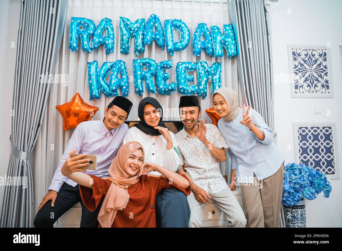 group of Muslim friends take a selfie together while ramadan Stock ...